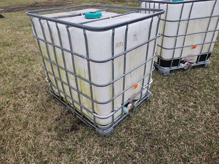 6645 - 250 GALLON POLY TANKS WITH CAGE - Bonnigson & Associates