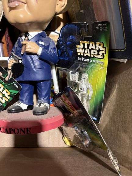 Al Capone statue, Star Wars figurines, sweater - Bonnigson & Associates