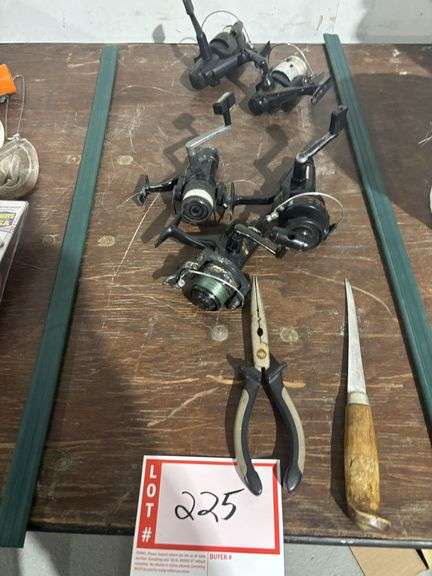 Fishing reels, pliers, and flea knife - Bonnigson & Associates