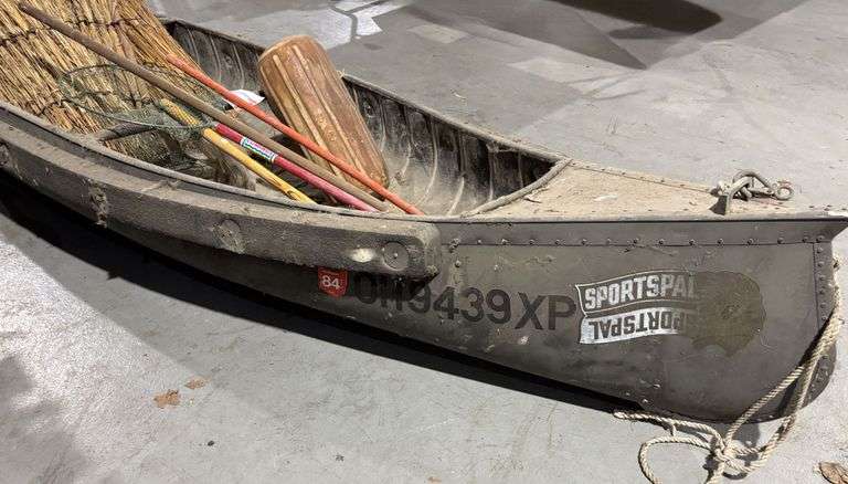 13 foot canoe, duck blinds, bumper, net, and gig - Bonnigson & Associates