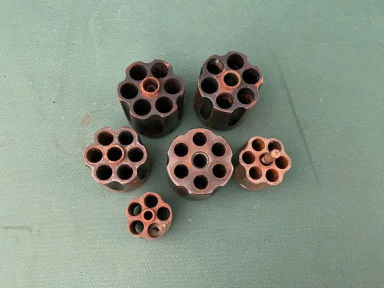 6 revolver cylinders 2 are 45 cal and 4 are 38 cal. - Brian Burke Auctions