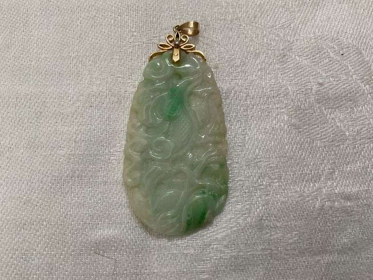 Gorgeous jade pendant with a 14 karat Bail and a small diamond chip ...