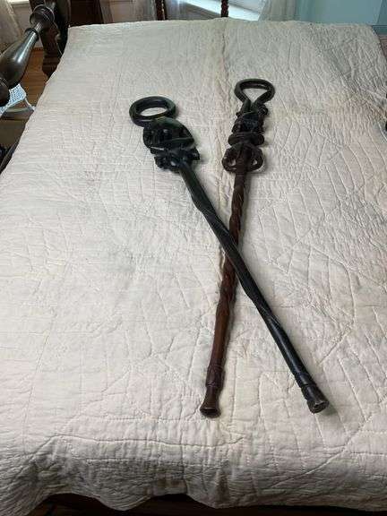 Two walking sticks, most likely acquired during the world travels to ...