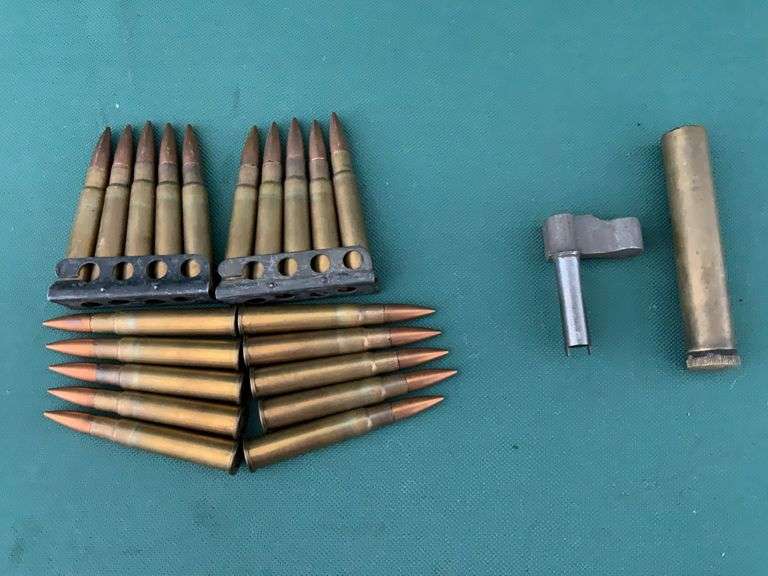 20 rds of 303 British 10 on stripper clips and a Enfield bolt tool ...