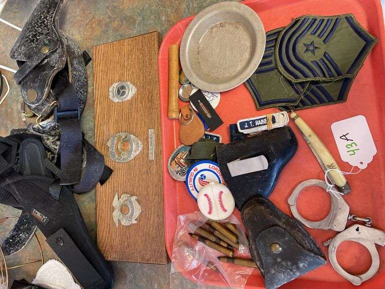 Lot includes handcuffs, straight, razor, military patches, some ammo ...