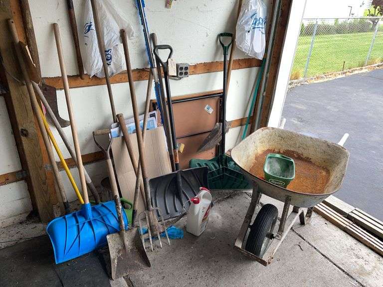 Heavy duty, wheelbarrow and assortment of hand, tools, and ...