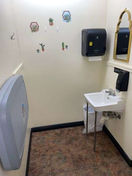 Contents of second restroom includes baby change Station, marathon ...