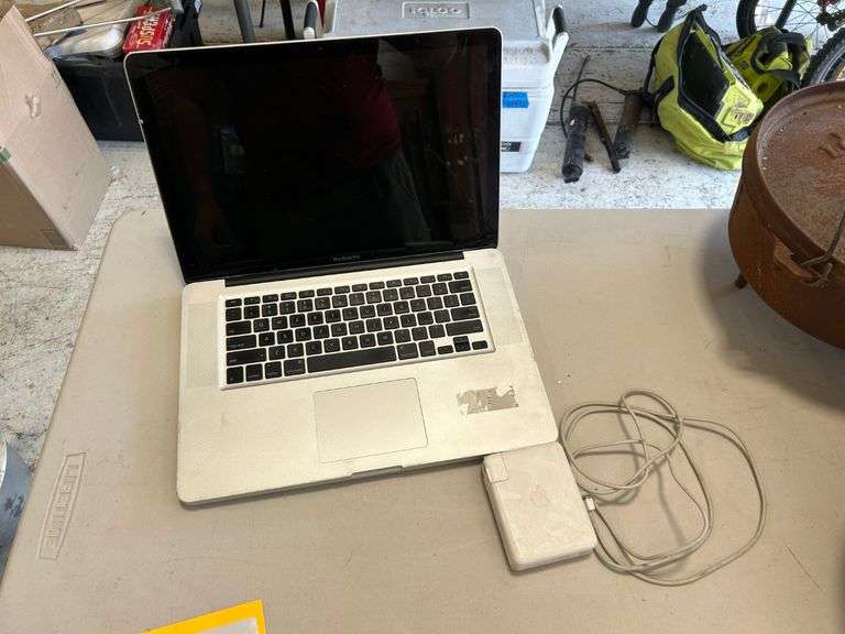 Macbook Pro Laptop - Prime Time Auctions, Inc.