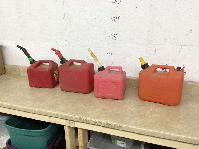 4 GAS CANS - Currie Auction Service