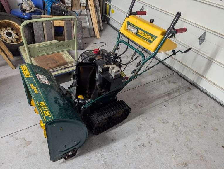 YARD-MAN 28" 10HP TRACK SNOWBLOWER - Currie Auction Service
