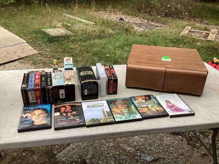DVD'S, VHS TAPES, & VHS TAPE ORGANIZER - Currie Auction Service