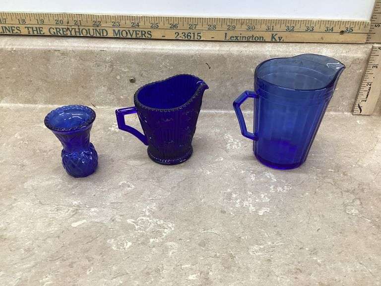2 SMALL COBALT BLUE PITCHERS AND TOOTHPICK HOLDER - Currie Auction Service