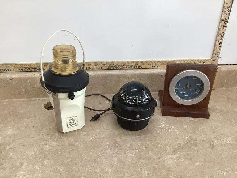 DEPTH METER GAUGE, BUOY LIGHT, AND COMPASS - Currie Auction Service