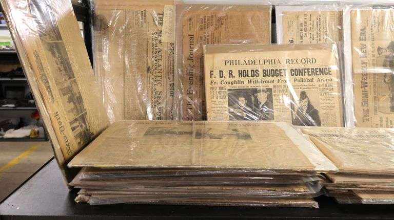 Collection of Antique Newspapers in Plastic - Dixon's Auction at Crumpton