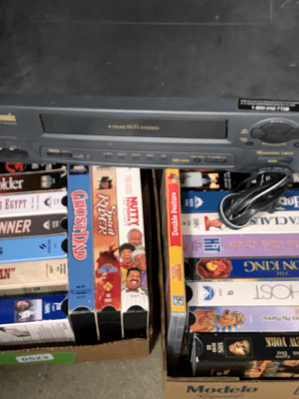Assorted VHS Tapes and Symphonic VHS Player - Delaware Auction Center