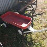 Child’s red pull wagon - Delaware Auction Center