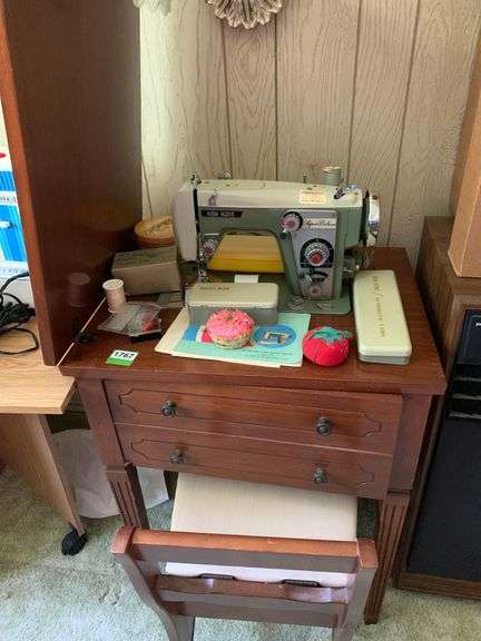 New Home Super Deluxe Sewing Machine w/ Stand - Delaware Auction Center