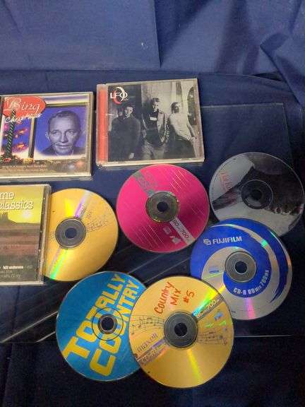 Assorted CDs - Delaware Auction Center