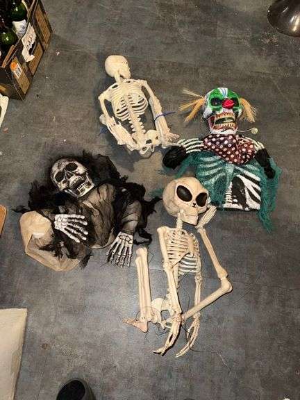Skeleton and clown decor • Basement bar - Duck Soup Auctions