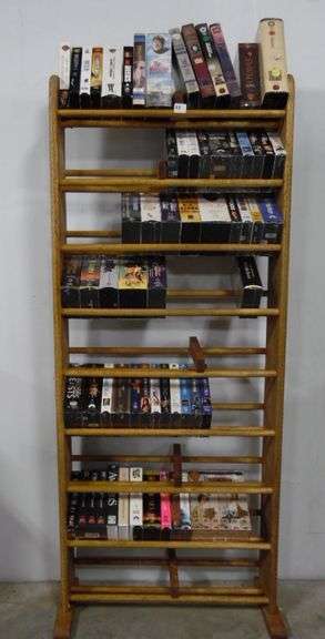 VHS Holder With Various VHS Movies - 24 1/2" x 7" x 60" - Dunker Auction