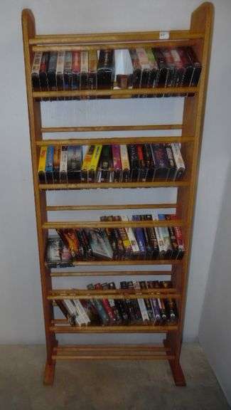 VHS Holder With Various VHS Movies - 24 1/2" x 7" x 60" - Dunker Auction