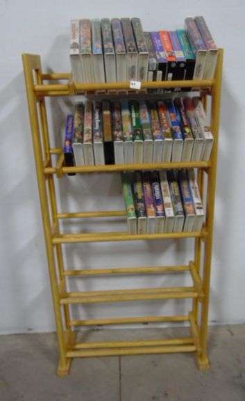 VHS Holder With Various VHS Tapes - 23" x 8" x 46 1/2" - Dunker Auction