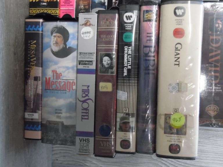 VHS Holder With Various VHS Movies - 24 1/2" x 7" x 60" - Dunker Auction