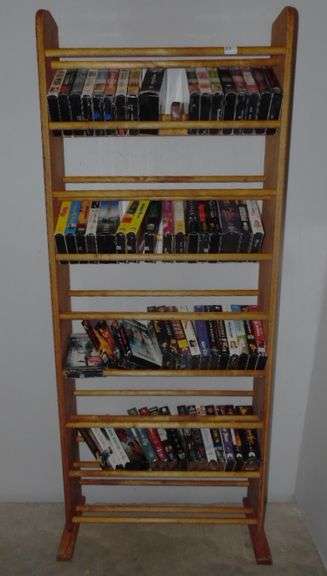 VHS Holder With Various VHS Movies - 24 1/2" x 7" x 60" - Dunker Auction