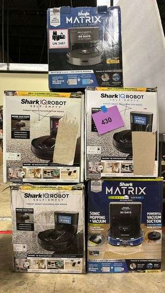 AS IS - (5) SHARK ROBOT VACUUMS IN BOXES - Earl's Auction Company