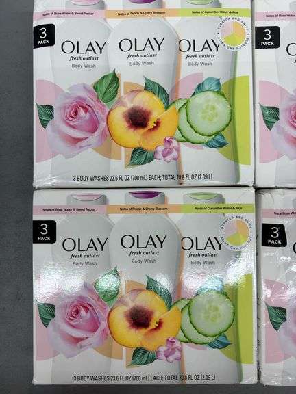 (12) BOTTLES OF OLAY BODY WASH IN BOXES - Earl's Auction Company