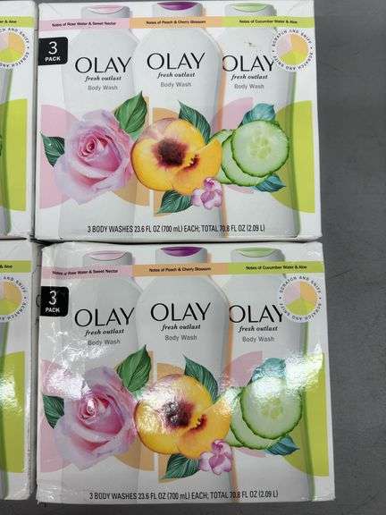 (12) BOTTLES OF OLAY BODY WASH IN BOXES - Earl's Auction Company