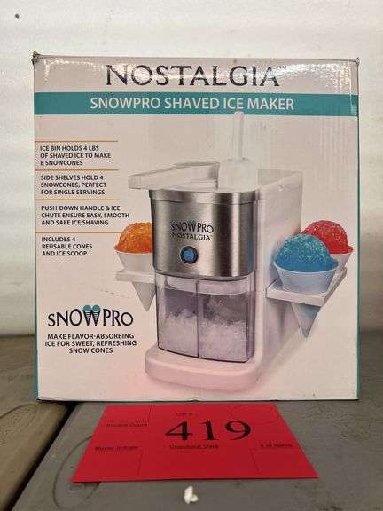 NOSTALGIA SNOWPRO SHAVED ICE MAKER IN BOX - Earl's Auction Company