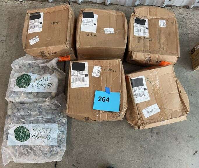 (12) BAGS OF YARD ELEMENTS ROCKS - Earl's Auction Company