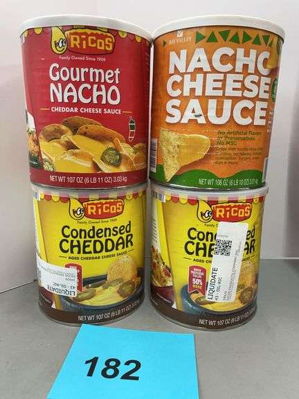 (4) CANS OF CHEESE SAUCE - Earl's Auction Company