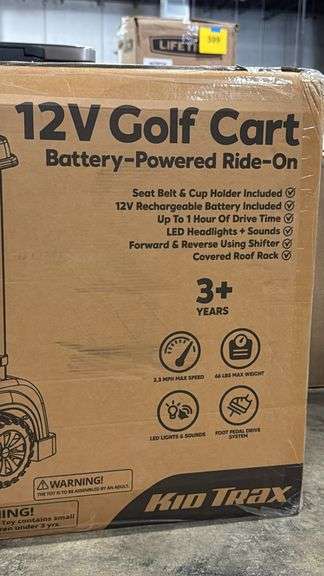 FLYBAR KIDS 12V GOLF CART RIDE ON IN BOX - Earl's Auction Company