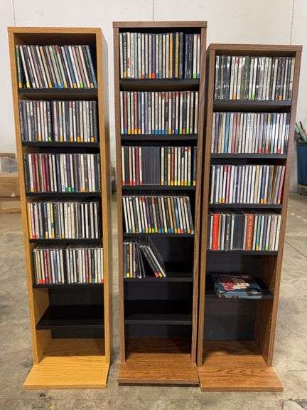 (3) CD RACKS W/ ASSORTED CDS - Earl's Auction Company