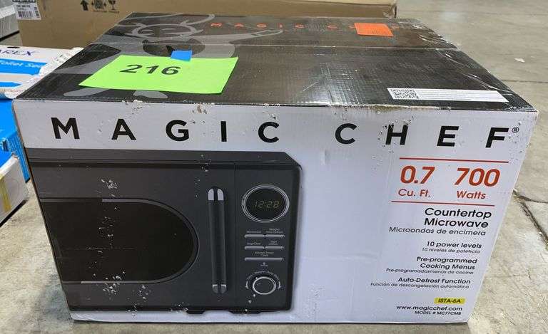 MAGIC CHEF 0.7CU FT COUNTERTOP MICROWAVE IN BOX - Earl's Auction Company