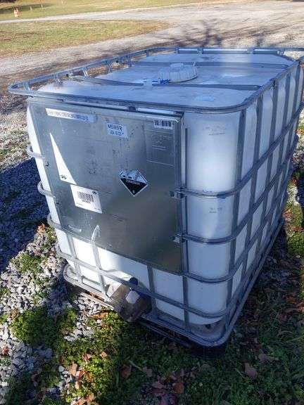 IBC TOTE IN CAGE 250 GALLON - EK Auctioneers LLC