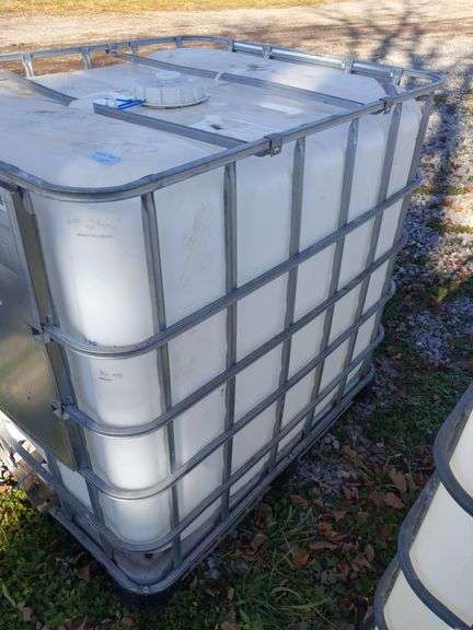 IBC TOTE IN CAGE 250 GALLON - EK Auctioneers LLC