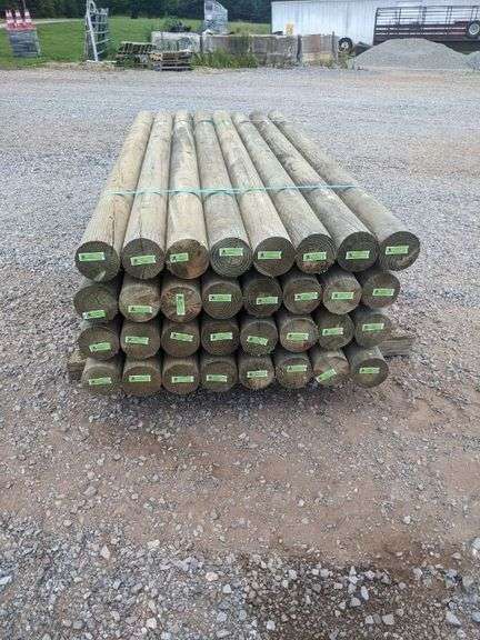 QTY (32) UNUSED 5"X8' PRESSURE TREATED POSTS - EK Auctioneers LLC