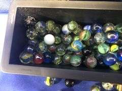 Marbles and storage box - Auction Services LTD