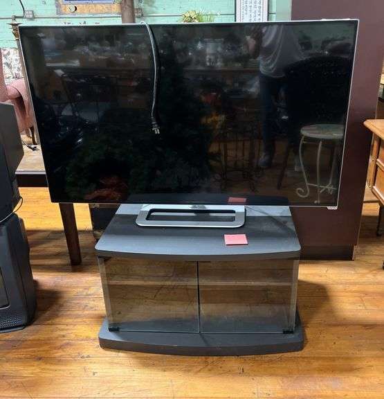 Television and stand - Auction Services LTD
