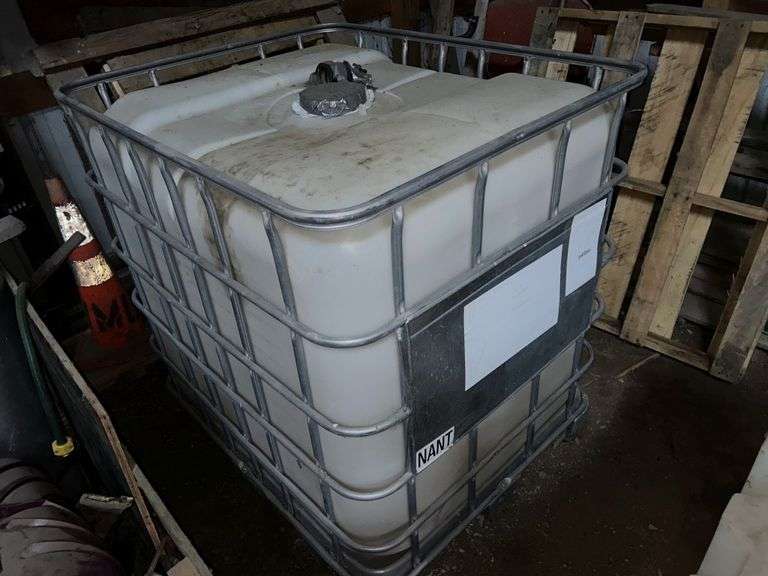 Poly cage tote, 265 gal, * last contained water - Fragodt Auction and ...