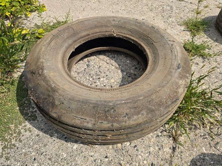 (1) 10.00-20 Used Tire - Fragodt Auction and Real Estate LLC
