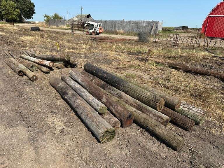 Assortment of Round Fence Posts - Fragodt Auction and Real Estate LLC