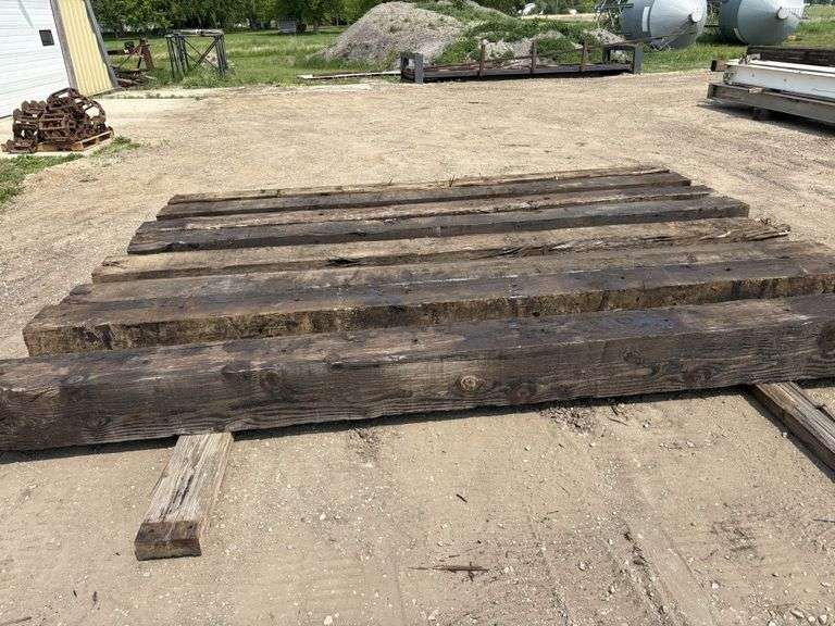 (8) 12”x12” x15’ Creosote Treated Bridge Beams, used, from a bridge at ...