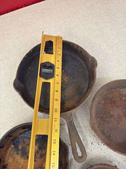 (4) cast iron skillets - Gary Realty & Auction