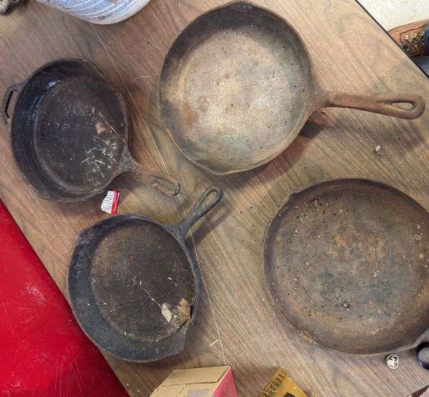 (4) cast iron skillets - Gary Realty & Auction