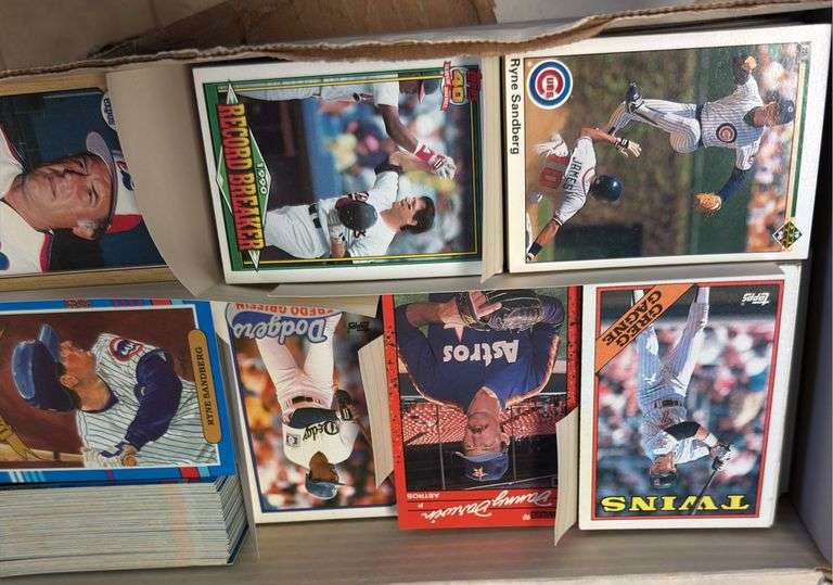 Pile of baseball, basketball, football cards - Gary Realty & Auction