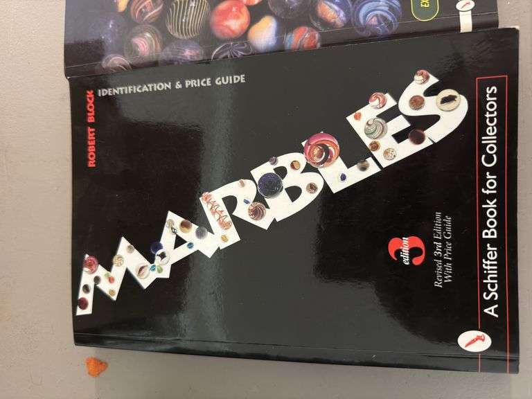 (2) marble books - Gary Realty & Auction